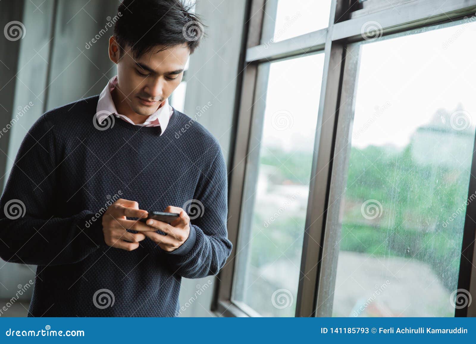 Image Of Asian Young Man Holding Smartphone Stock Image Image Of