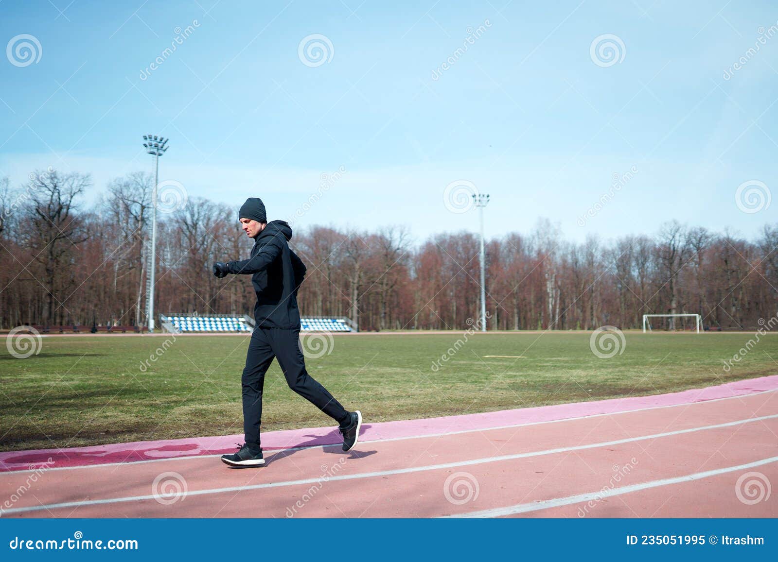 Image of Athlete Man Running through Stadium during Spring Jog . Stock ...