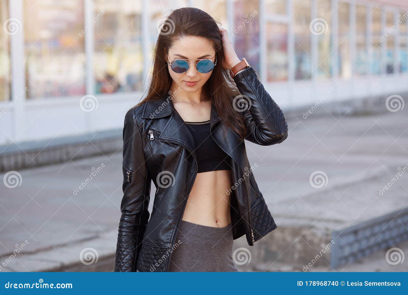 Image Of Attractive Dark Haired Female Wearing Stylish Leather Jacket