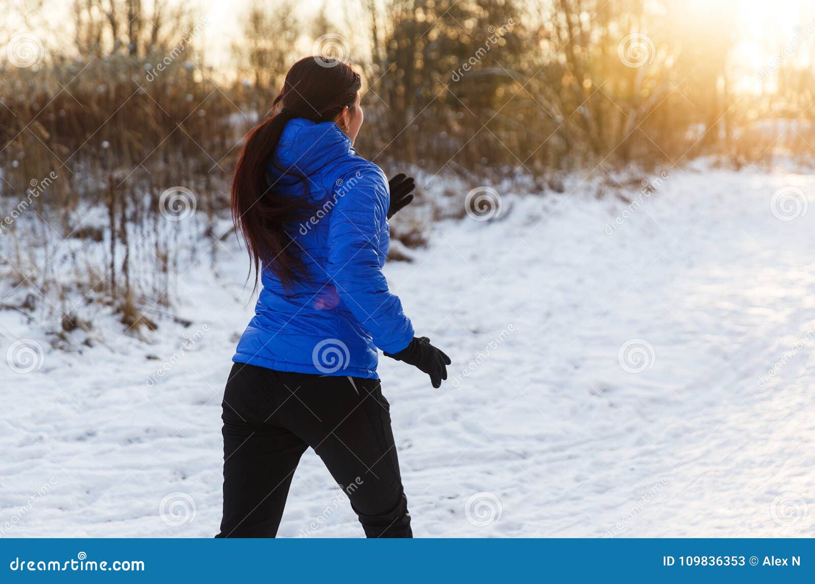 Image from Back of Athlete in Blue Jacket on Run in Winter Stock Image ...