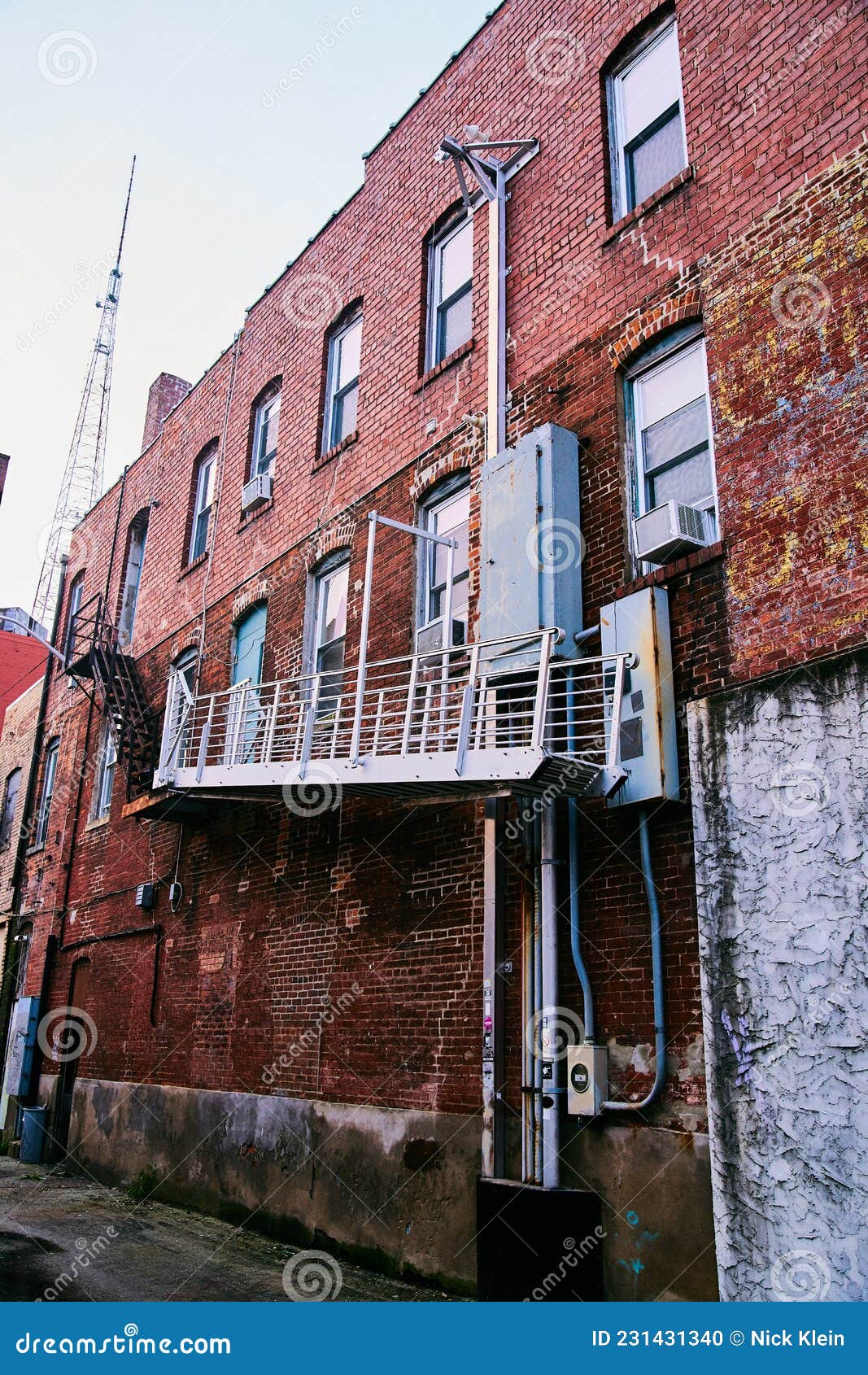Back of Building Downtown Covered in Brick with Metal Staircase Stock ...