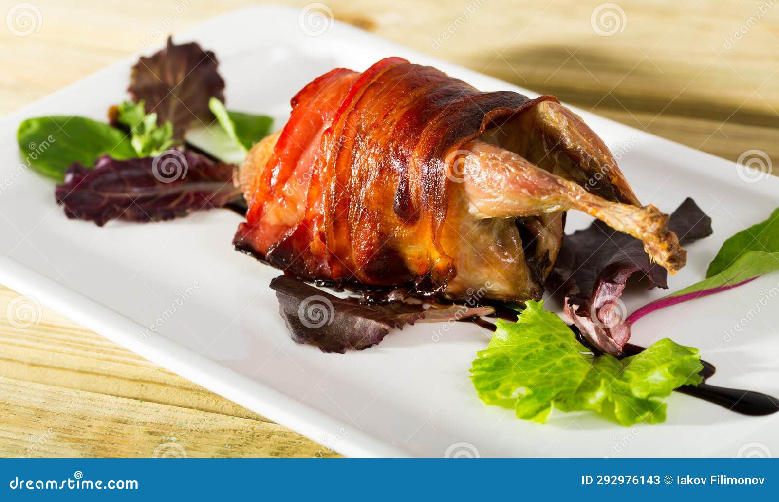 Image of Baked in Bacon Quail with Balsamic Sauce on the Plate Stock ...