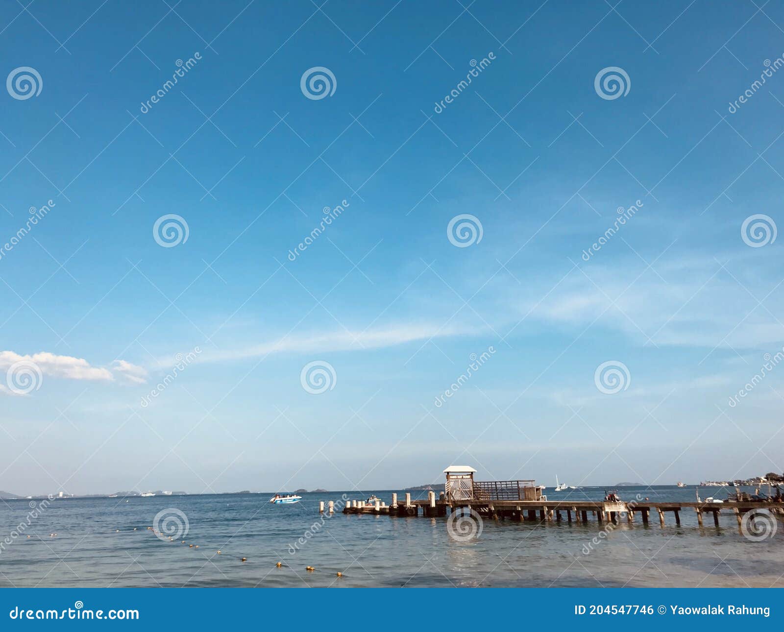 The Image of the Beach and the Bright Blue Sea Stock Photo - Image of ...