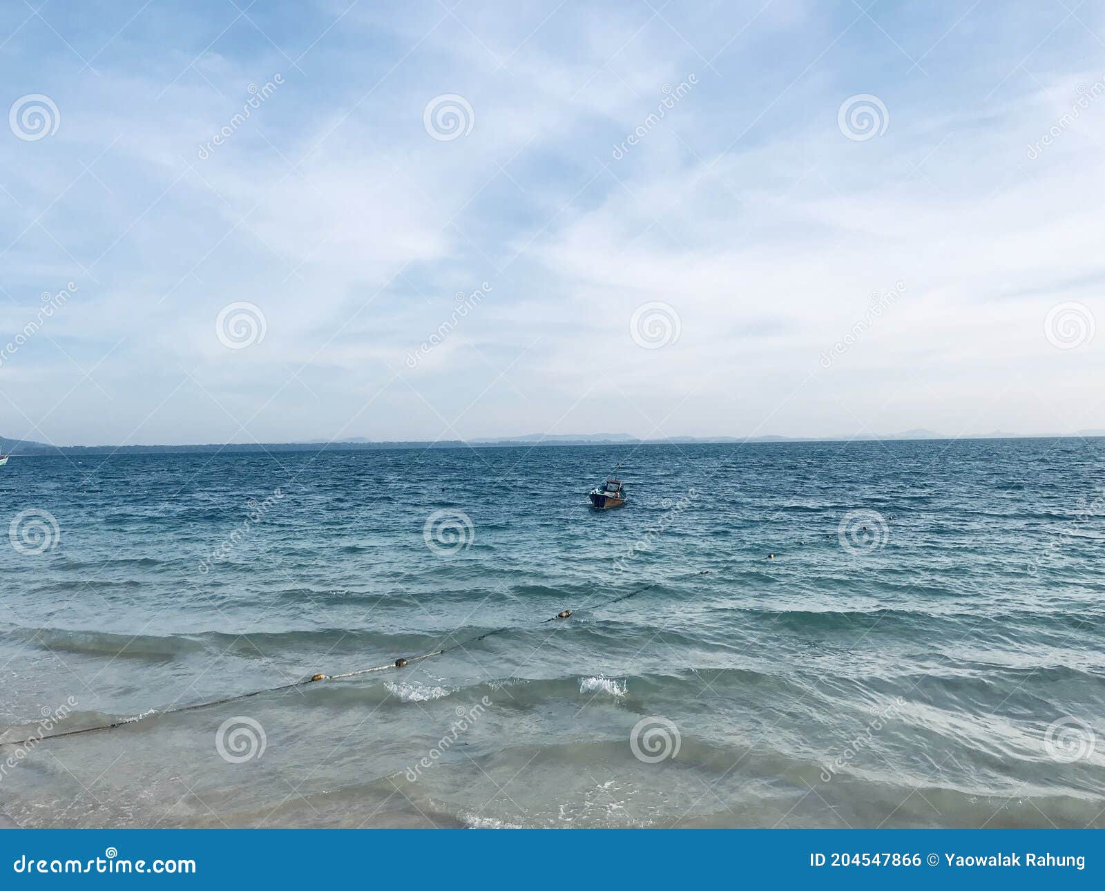 The Image of the Beach and the Bright Blue Sea Stock Photo - Image of ...