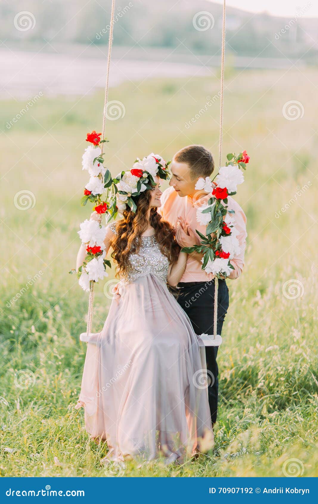 Image of Beatiful Couple in-love Embracing on Tree Swing Outside Stock ...
