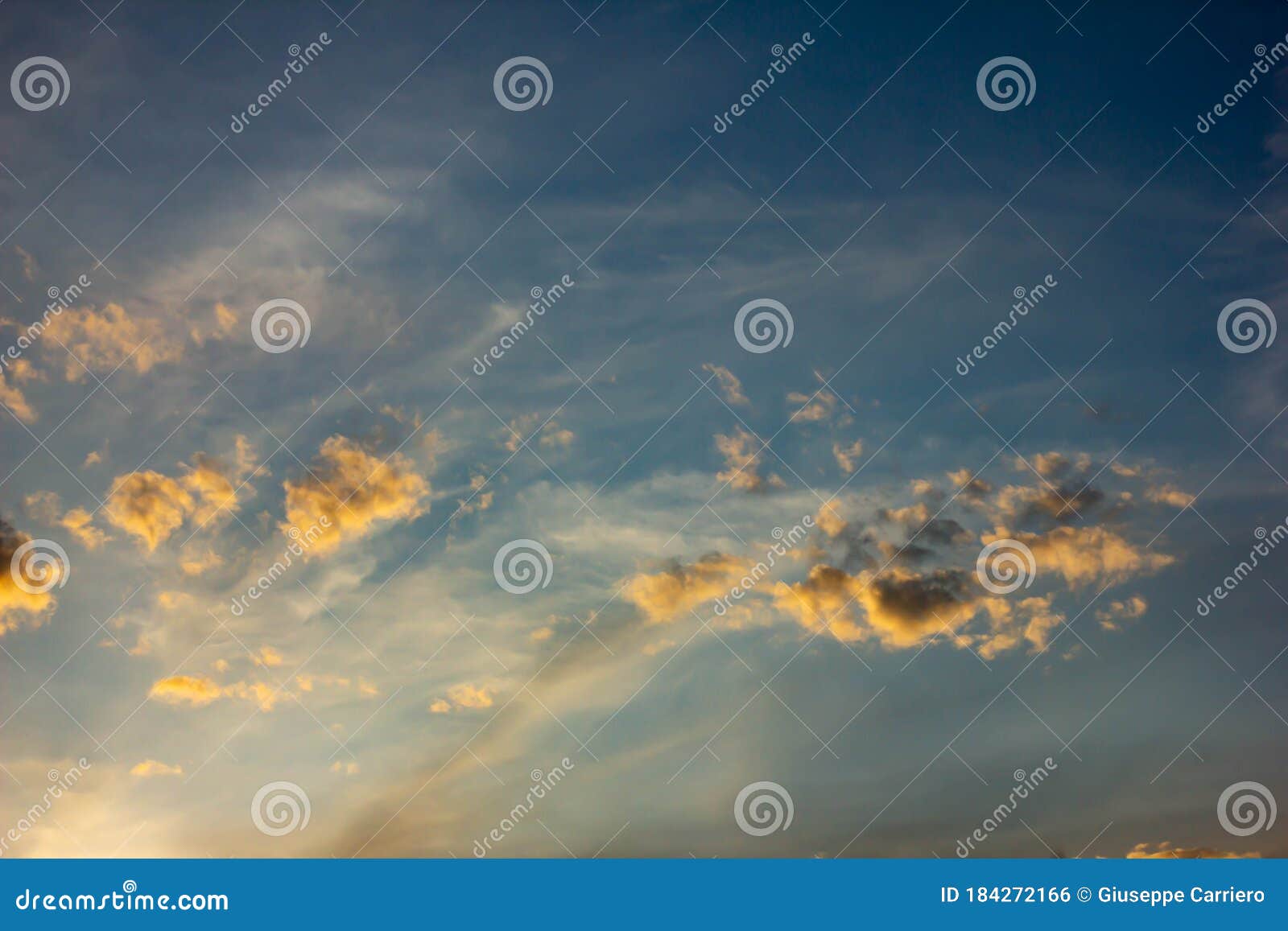 Image of a Beautiful Blue Sky at Sunset with Clouds Hit by the Last ...