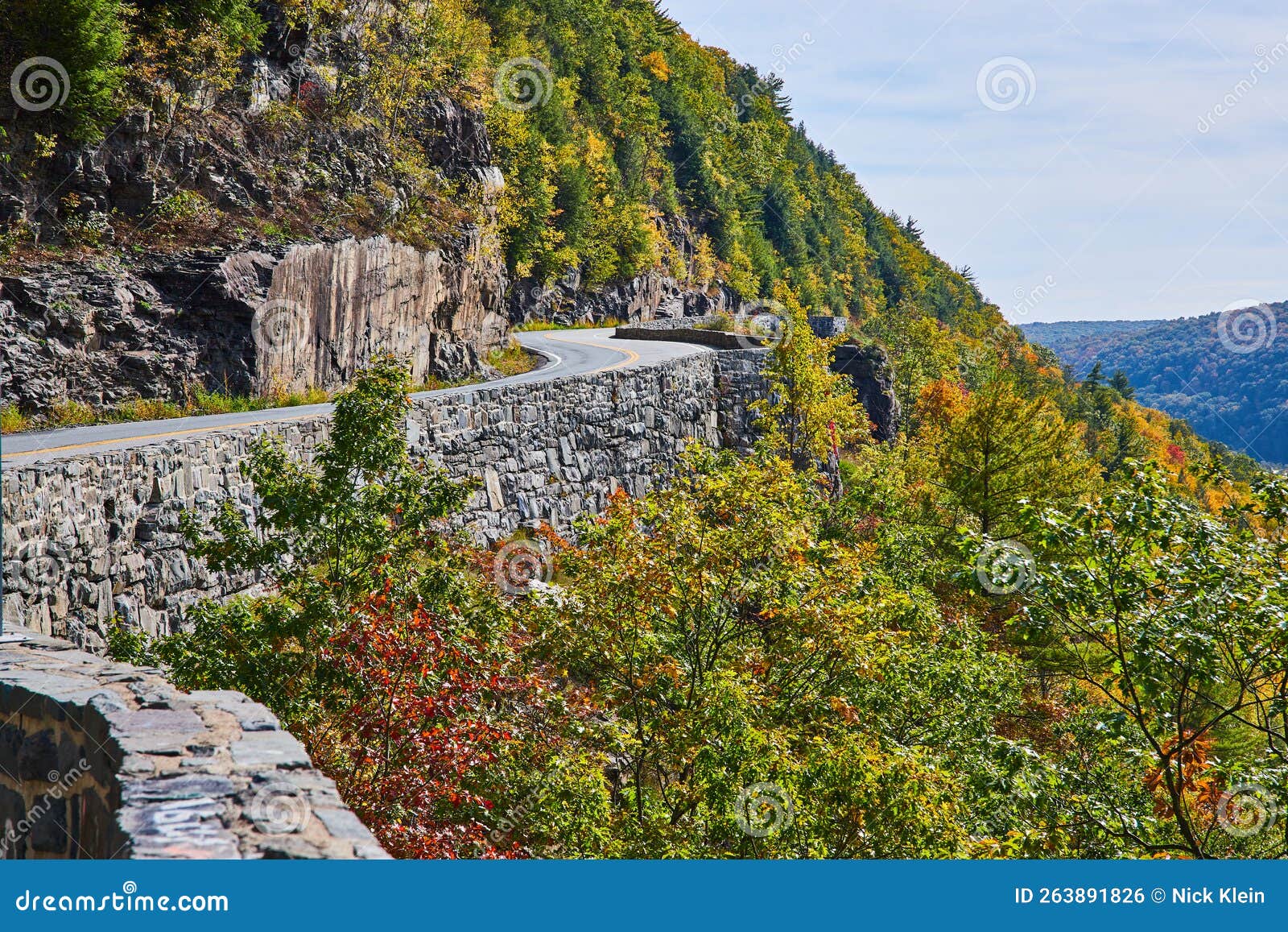 Beautiful Highway Winding through Cliffs and Mountains with Stone Wall ...