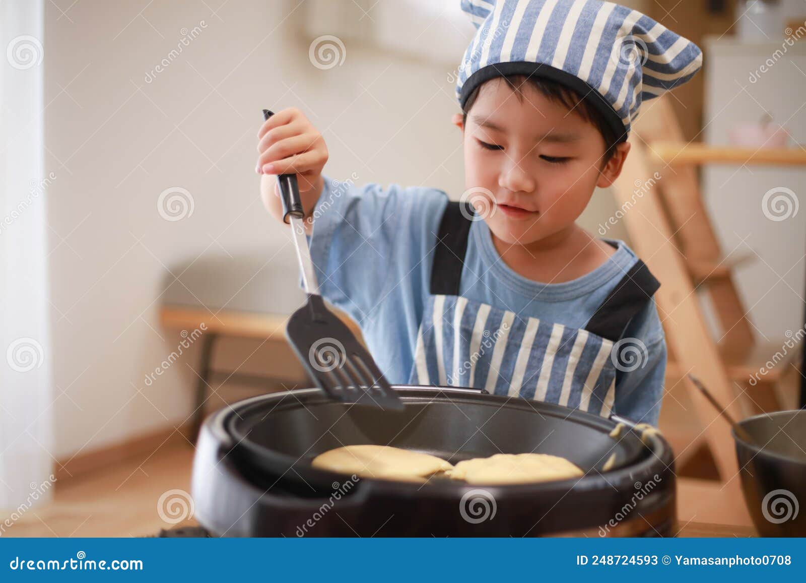 Boy making pancakes stock image. Image of kindergarten - 248724593