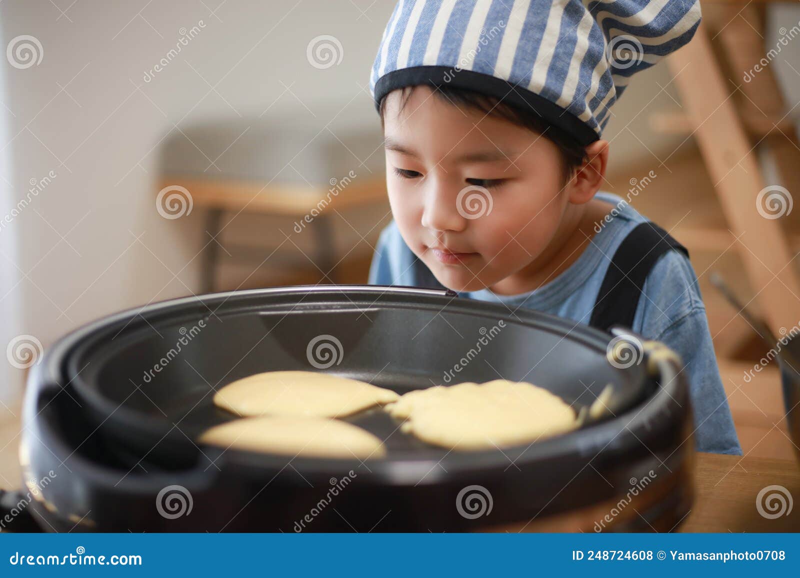 Boy making pancakes stock photo. Image of children, cooking - 248724608
