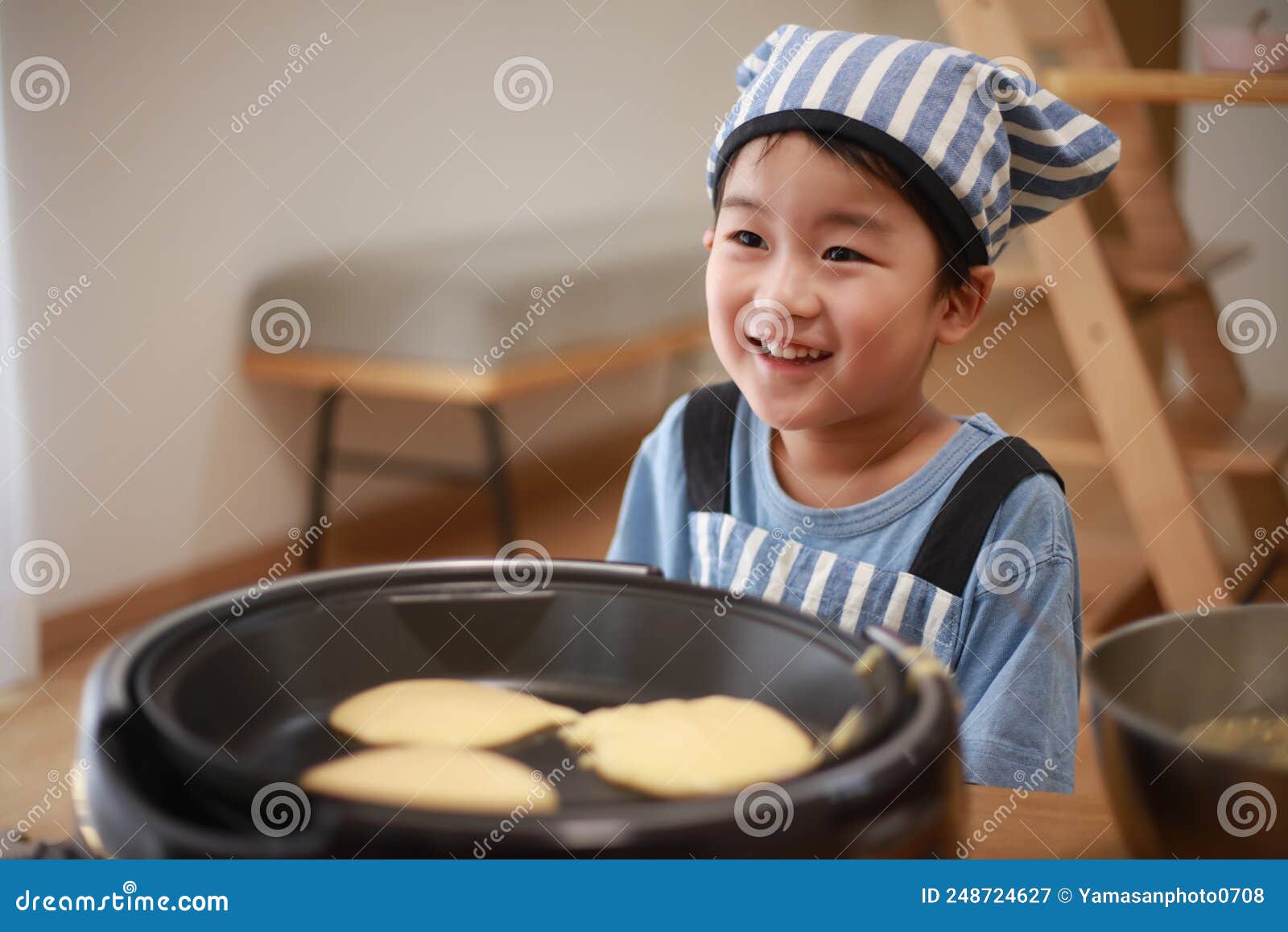 Boy making pancakes stock image. Image of childcare - 248724627