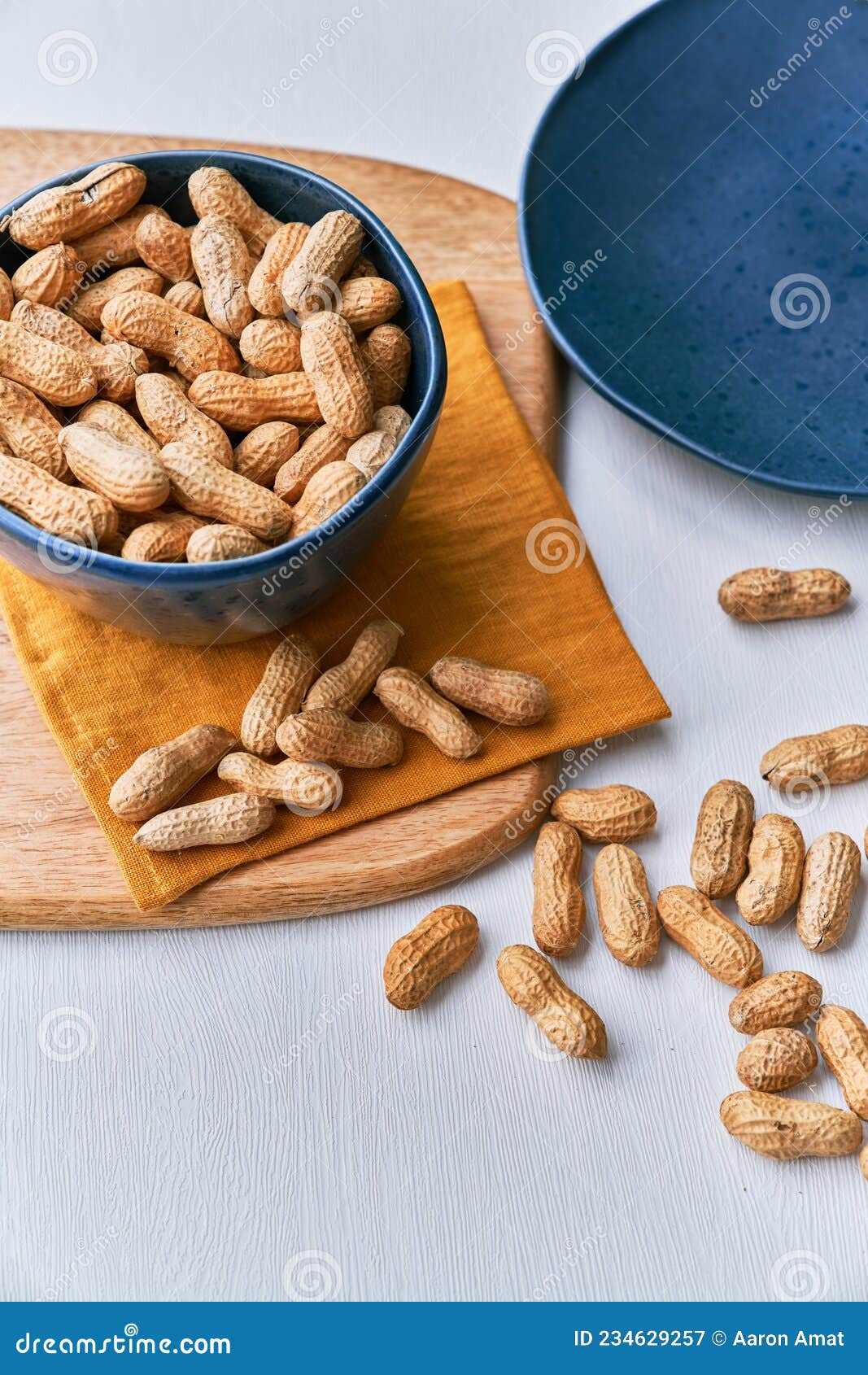 Image of Bunch of Peanuts in a Bowl on a Table Stock Image - Image of ...