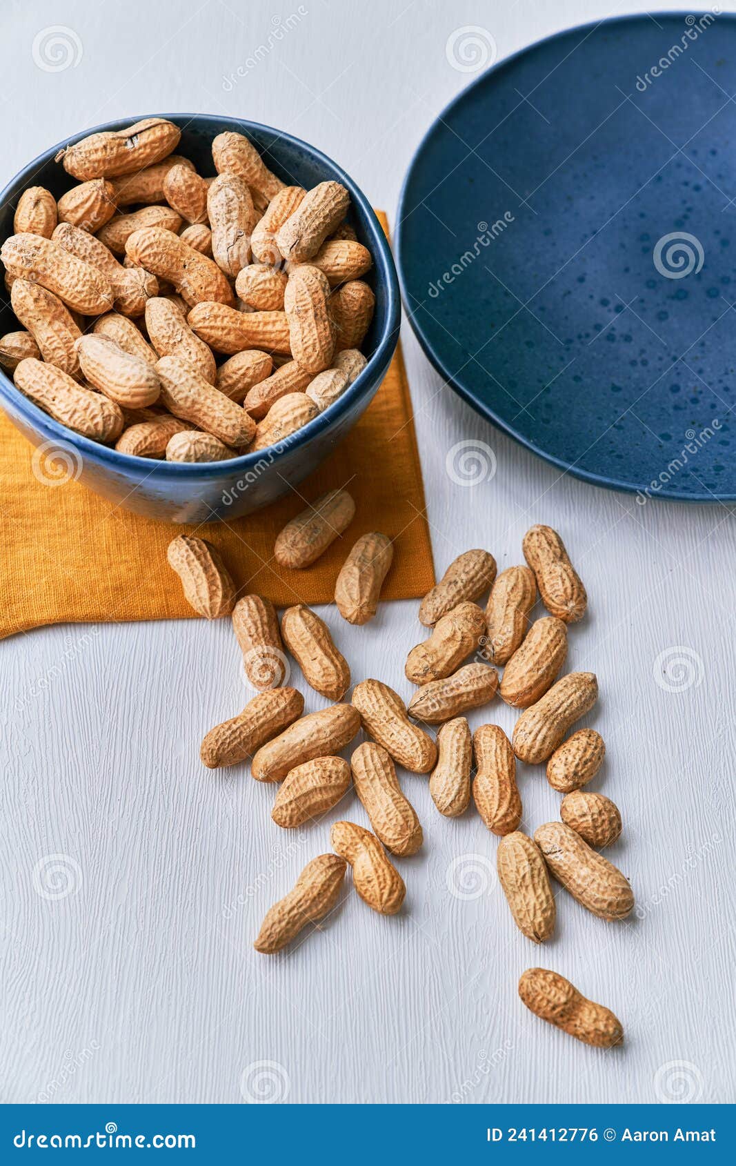 Image of Bunch of Peanuts in a Bowl on a Table Stock Photo - Image of ...