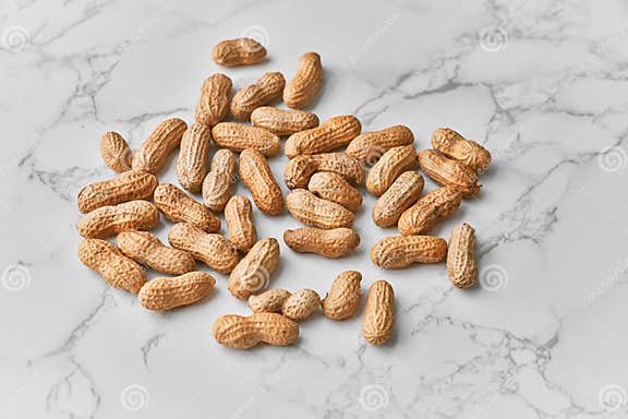 Image of Bunch of Peanuts on a Marble Table Stock Photo - Image of ...