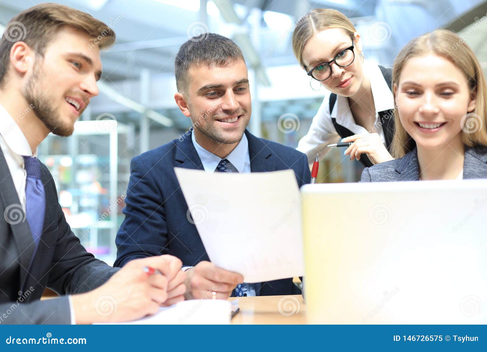 Image of Business Partners Discussing Documents and Ideas at Meeting ...