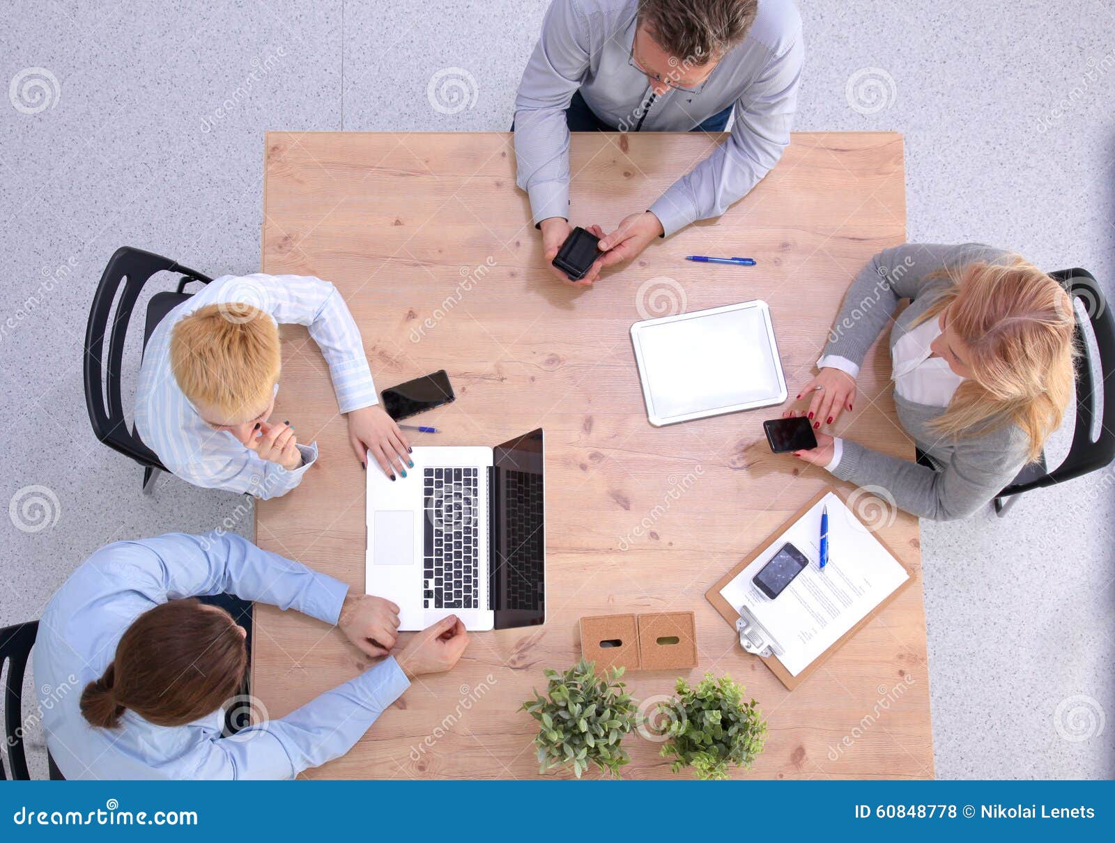 Image of Business Partners Discussing Documents Stock Photo - Image of ...