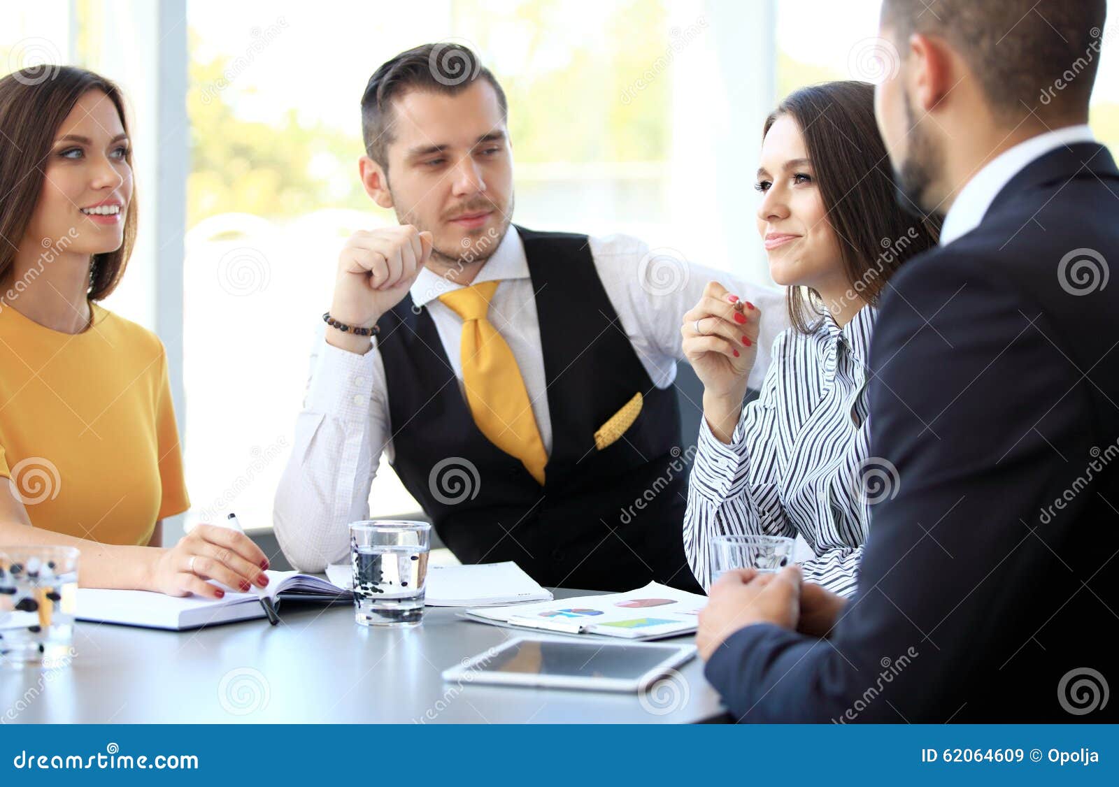 Image of Business Partners Discussing Documents and Ideas Stock Image ...