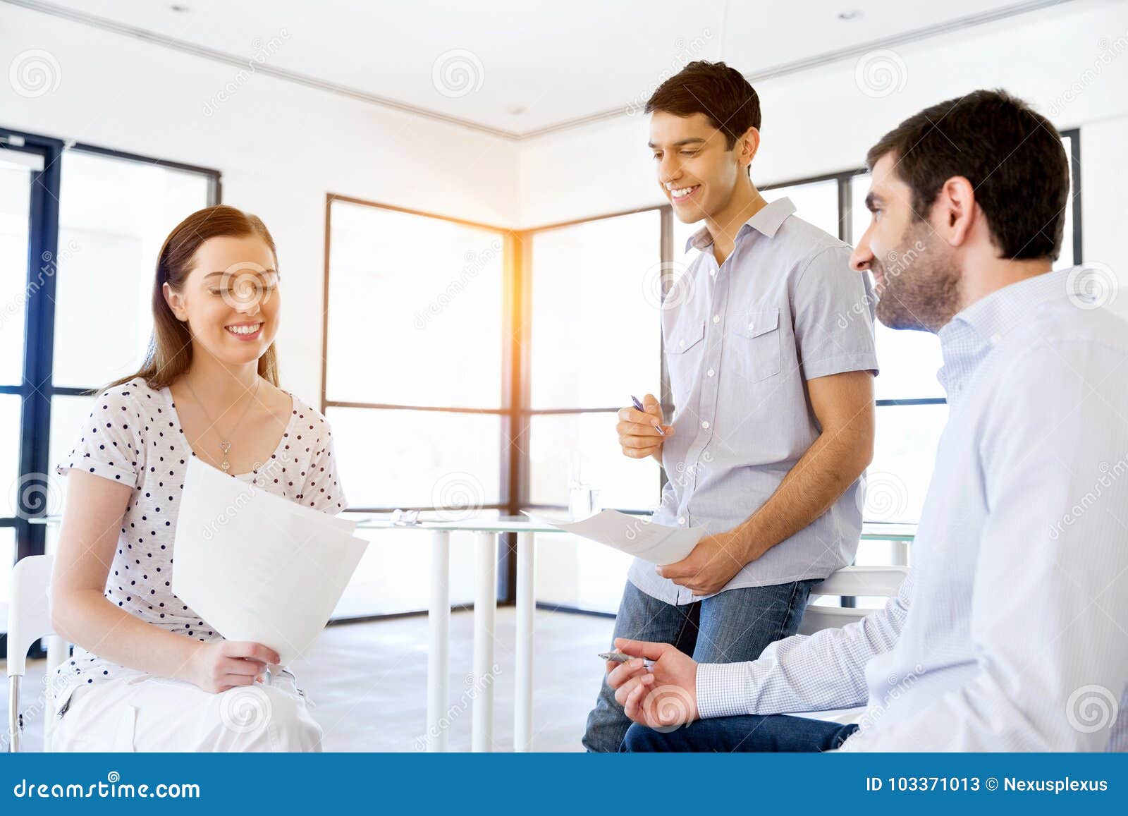 Image of Business Partners Discussing Documents and Ideas Stock Image ...