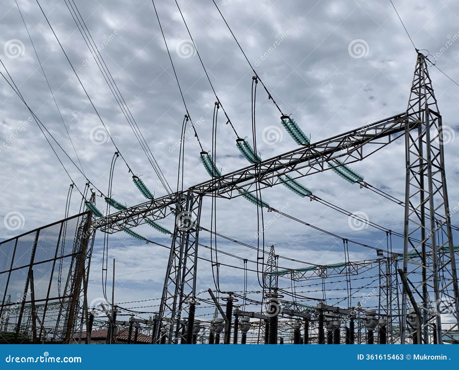 The Image Captures An Electrical Substation With A Network Of High ...