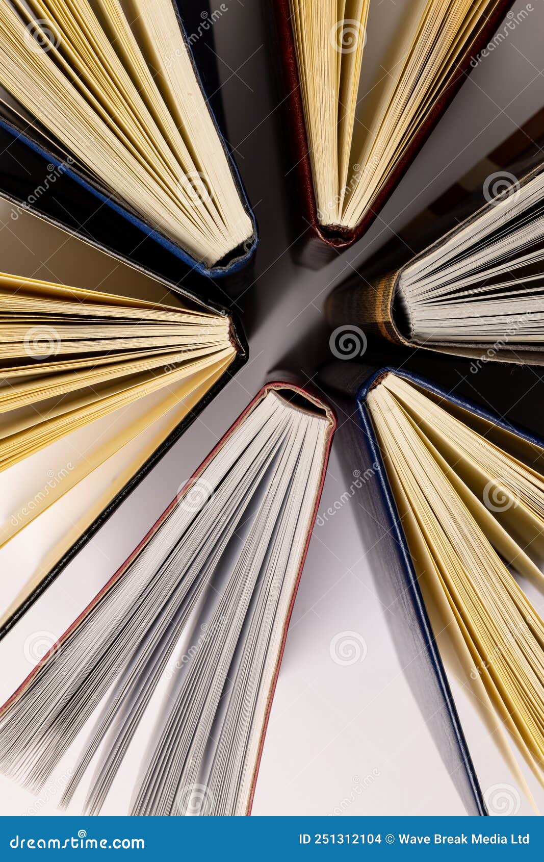 Image of Central Composition with Books Standing on White Surface Stock ...