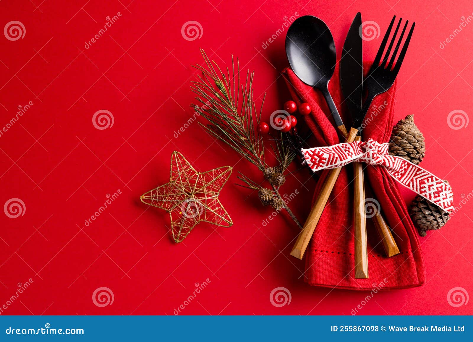 Image of Christmas Place Setting with Cutlery and Copy Space on Red ...