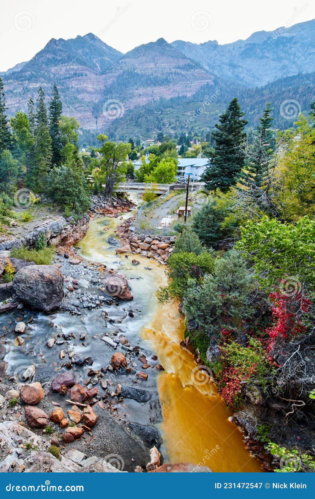 Clear and Brown Rivers Mixing Together in Gorge with Mountains in the ...