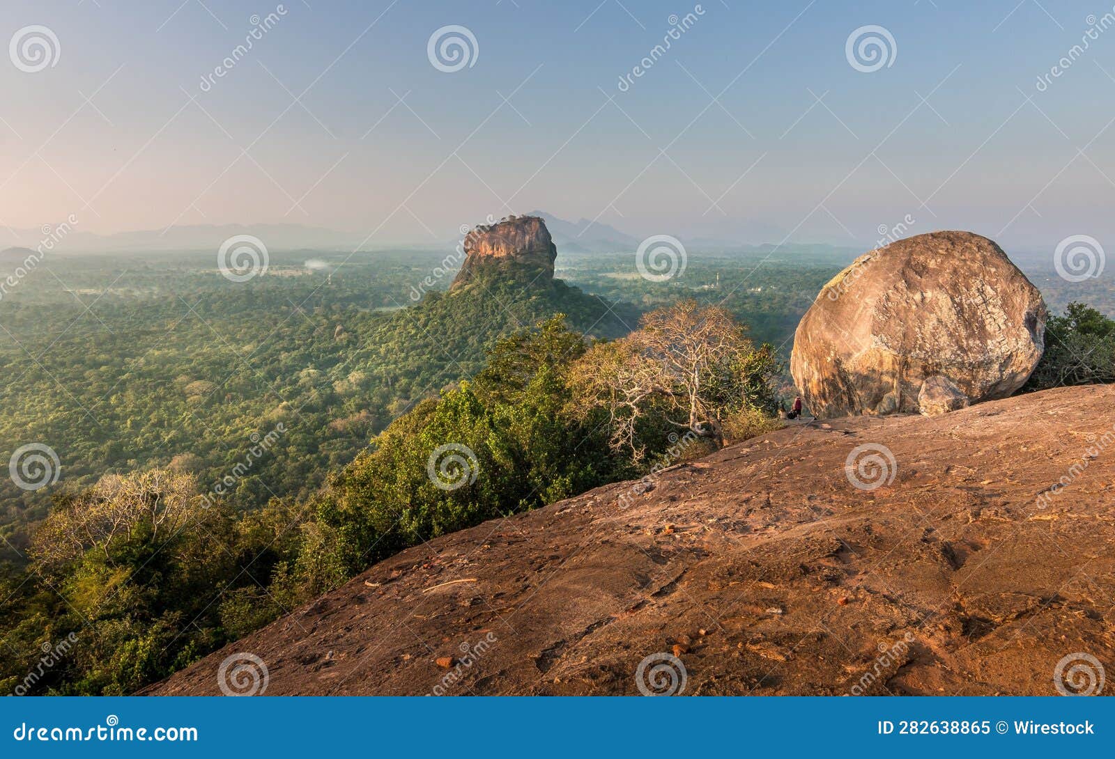 An Image of a Cliff with Some Boulders in it in the Middle Stock Image ...