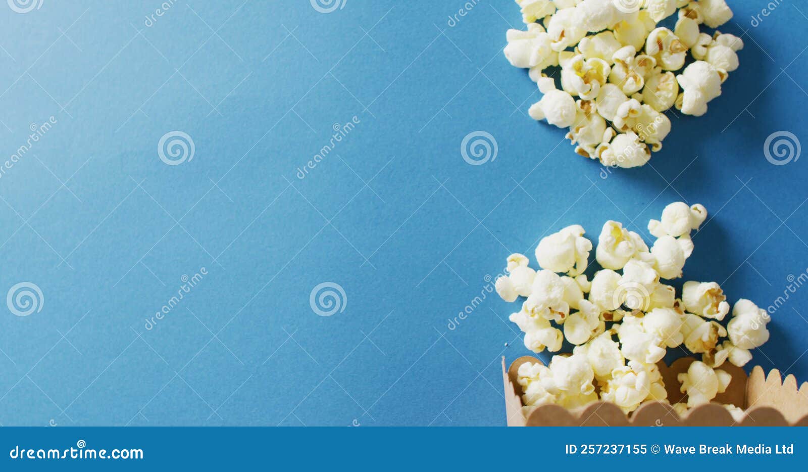 Image of Close Up of Box of Popcorn on Blue Background Stock Image ...