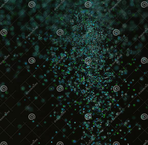 Image of Close Up of Multiple Green Particles on Dark Background Stock ...