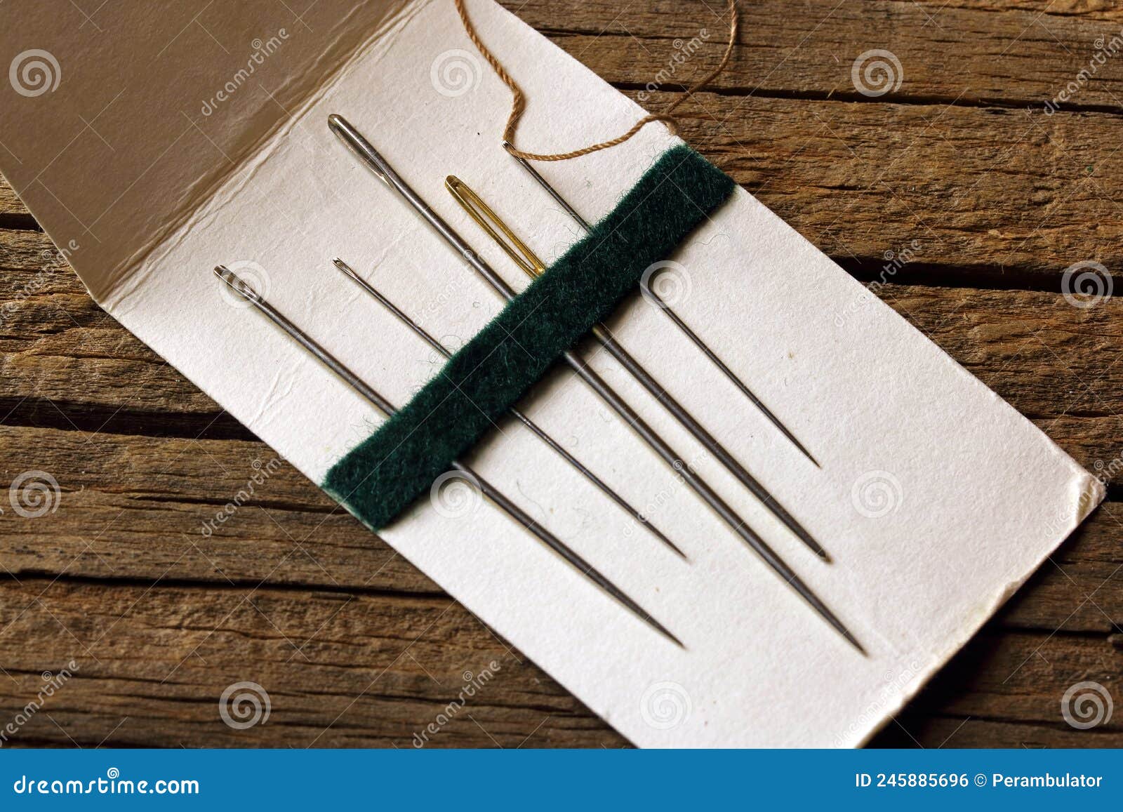 ASSORTED SEWING and DARNING NEEDLES on a CARD with a THREAD in ONE ...