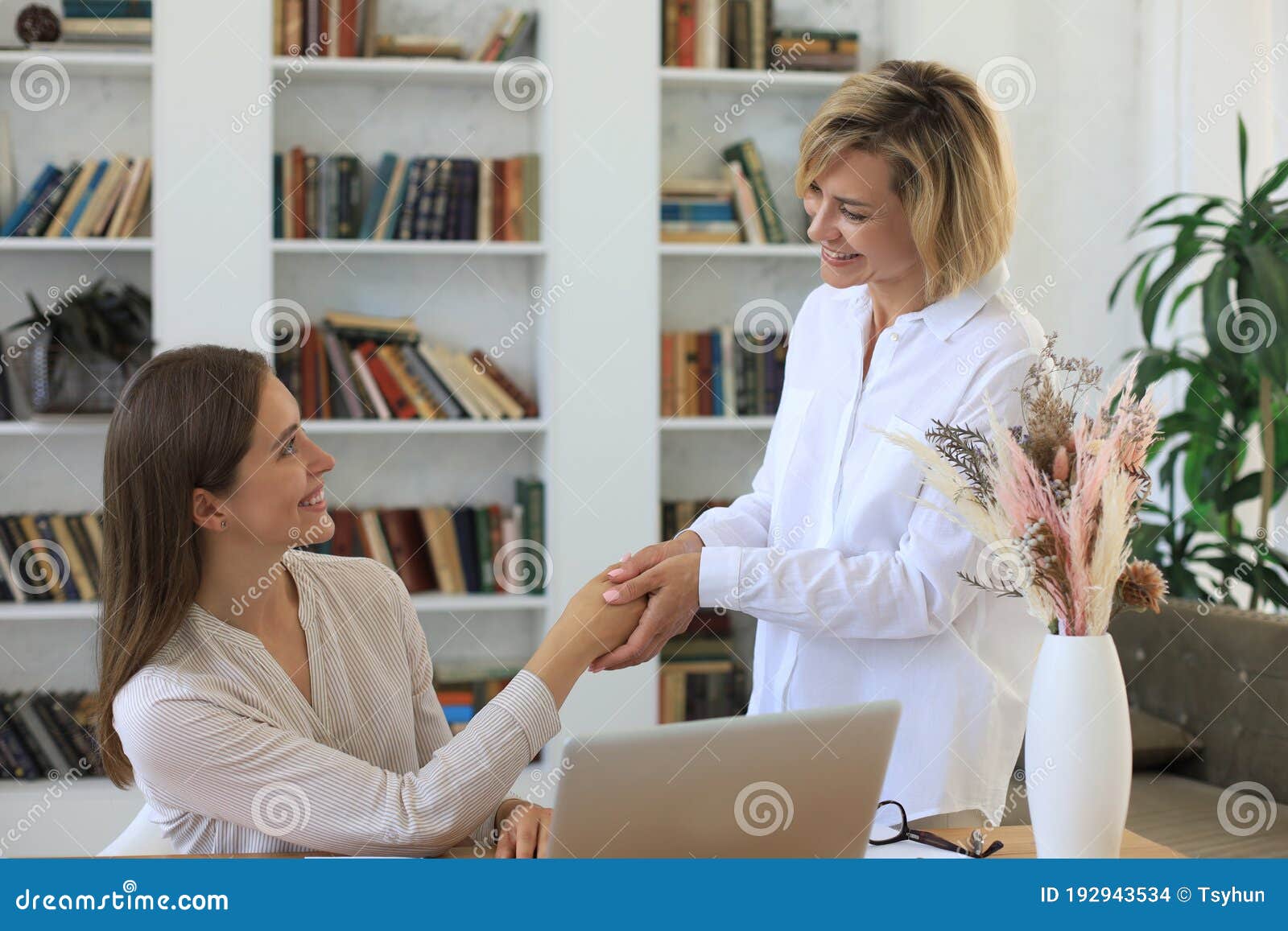 Image of Collegues Discussing Documents and Shaking Hands Stock Photo ...