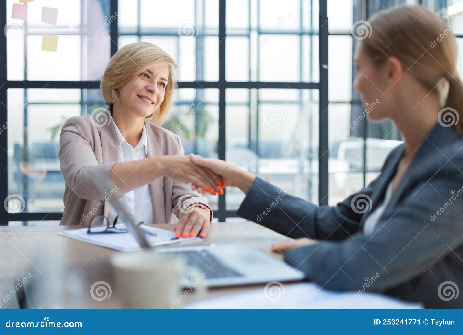 Image of Collegues Discussing Documents and Shaking Hands. Stock Image ...