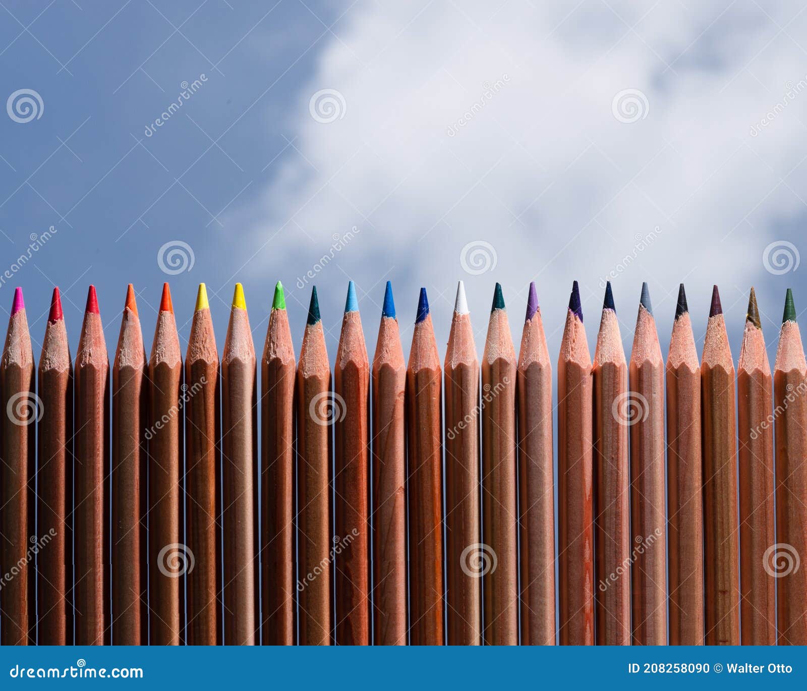 Line of Colored Crayons on a Blue Sky with Clouds Stock Photo - Image ...