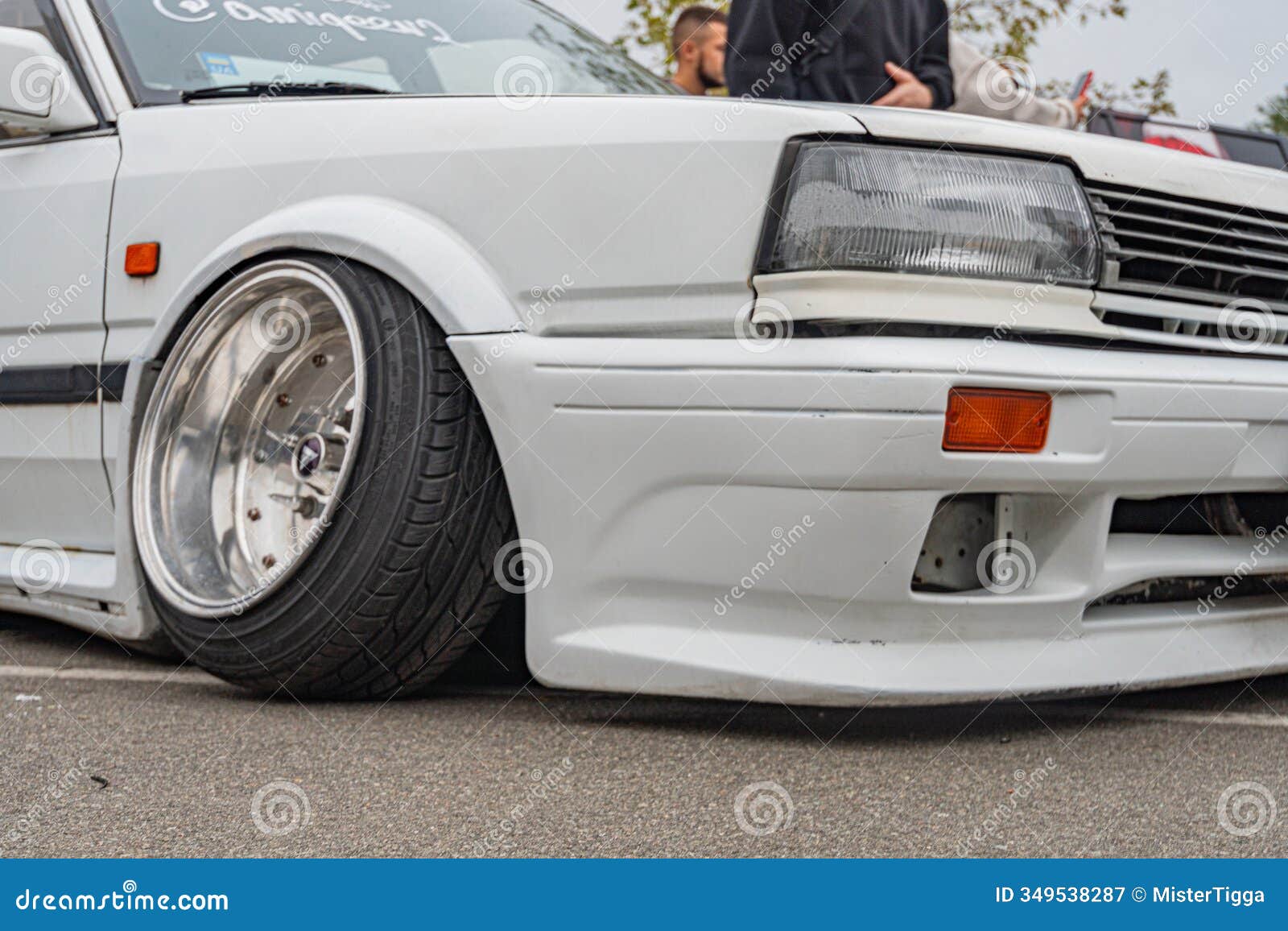 Image is a Composite of Two Angles of a Modified White Compact Car ...