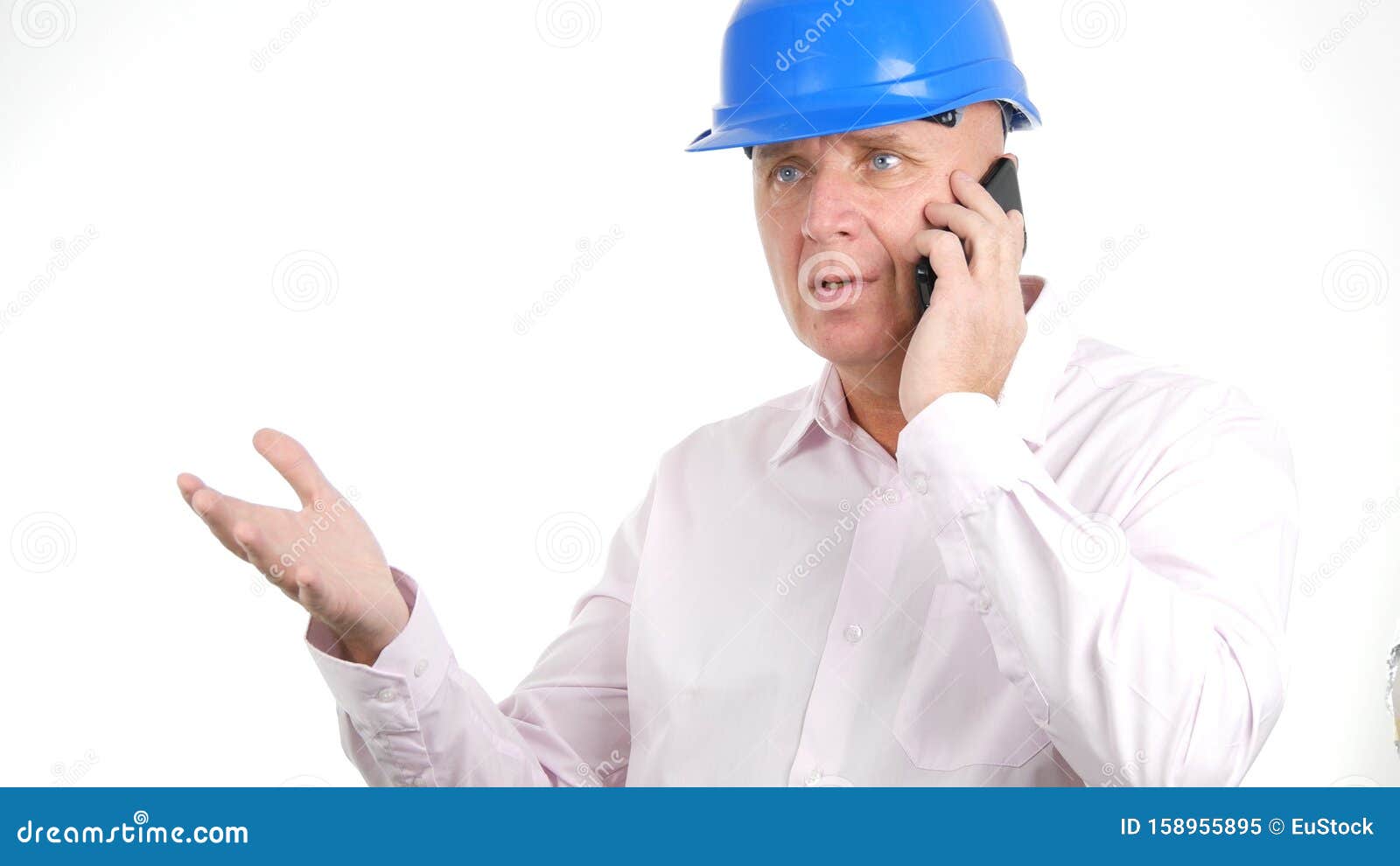 Image with a Confident Engineer Talking To Mobile and Gesticulating ...
