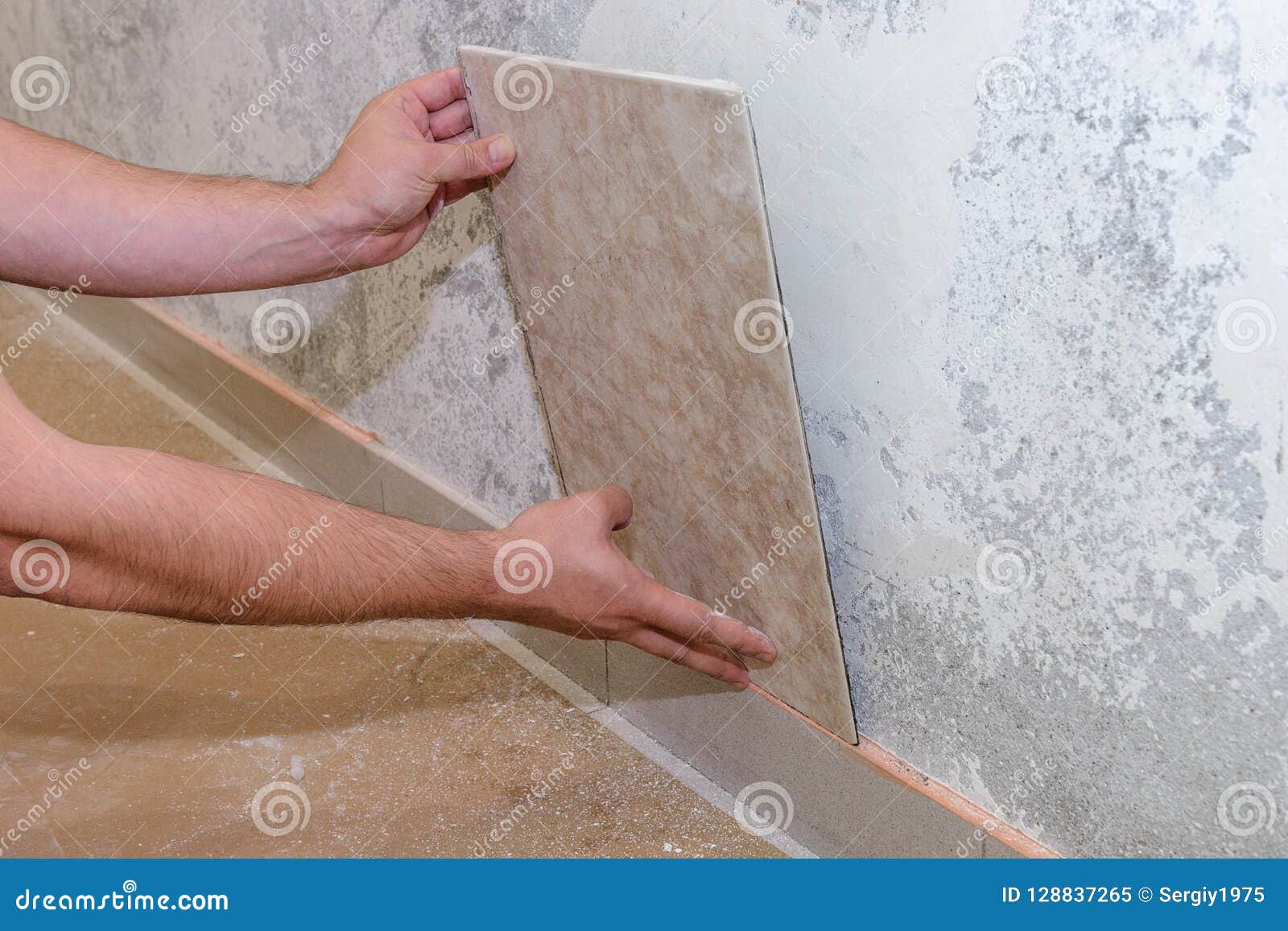 Construction Work Laying Tile on the Wall Close Up Stock Image - Image ...