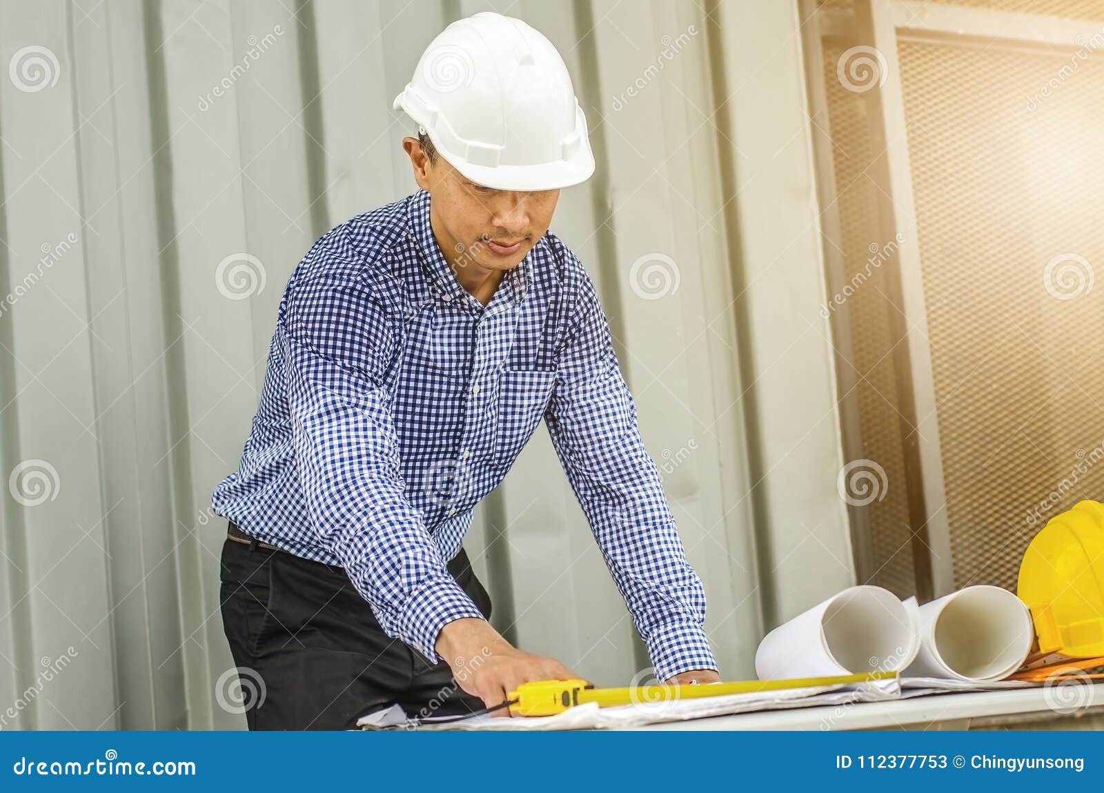 Image of Constructor Sketching Plans Together and Drawing Tools Stock ...