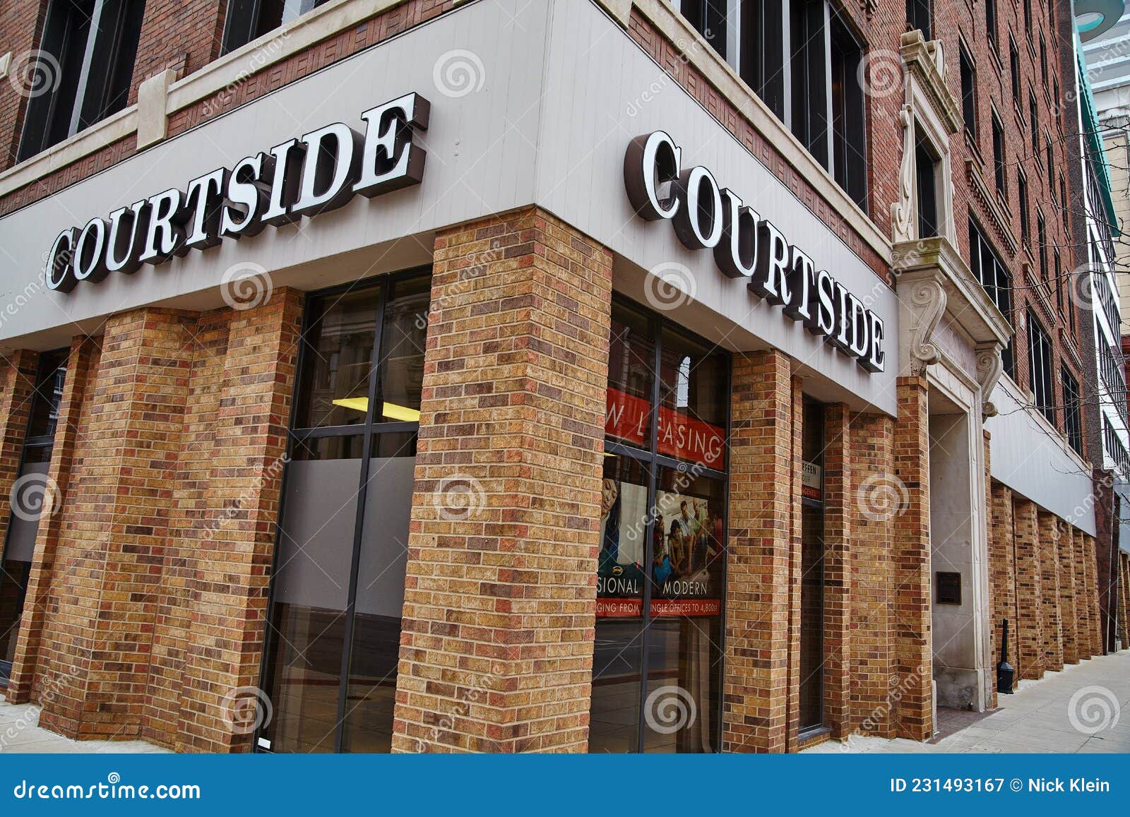 Corner of a Brick Building Downtown that Says Courtside Editorial ...