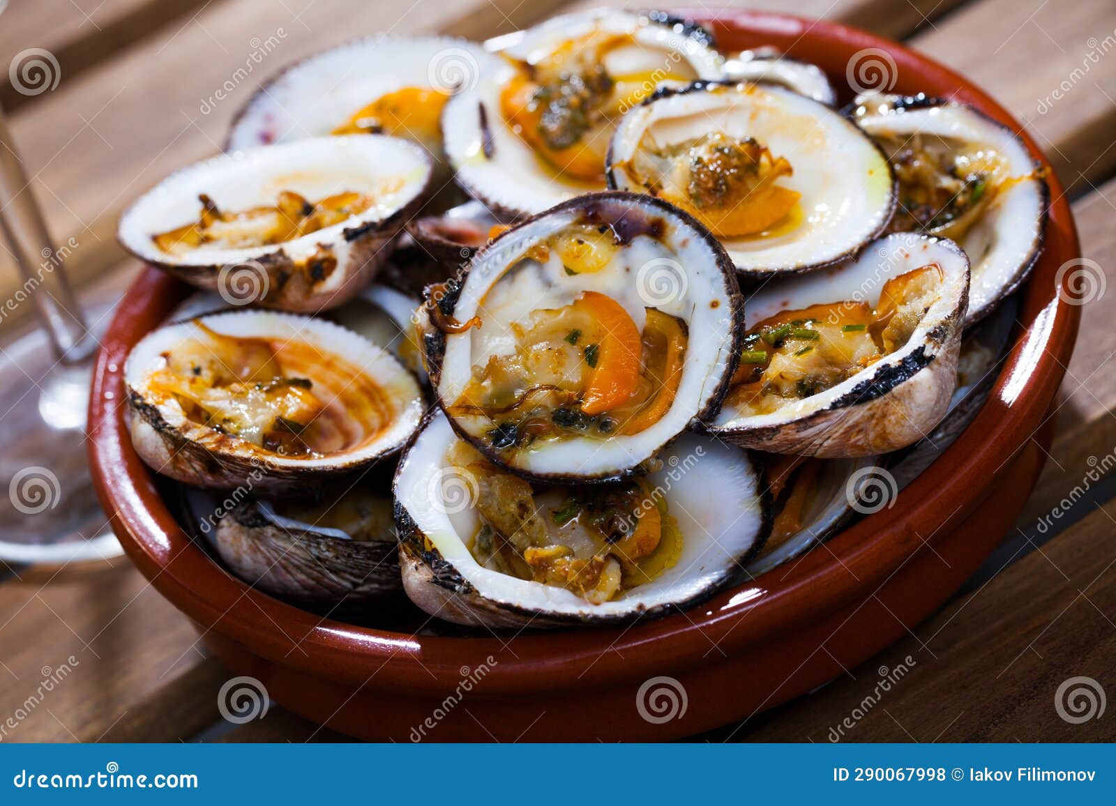 Deliciously Seafood with Baked in Oven Open Seashell at Plate on Table ...