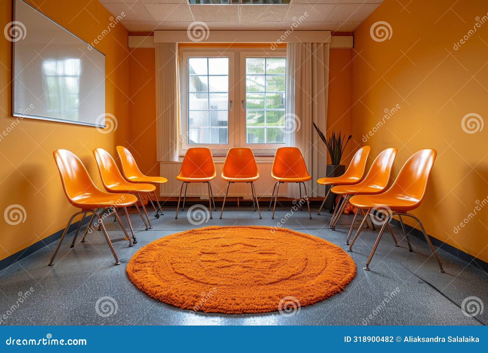 Image Depicting a Circle of Chairs, Whiteboard, and a Supportive ...