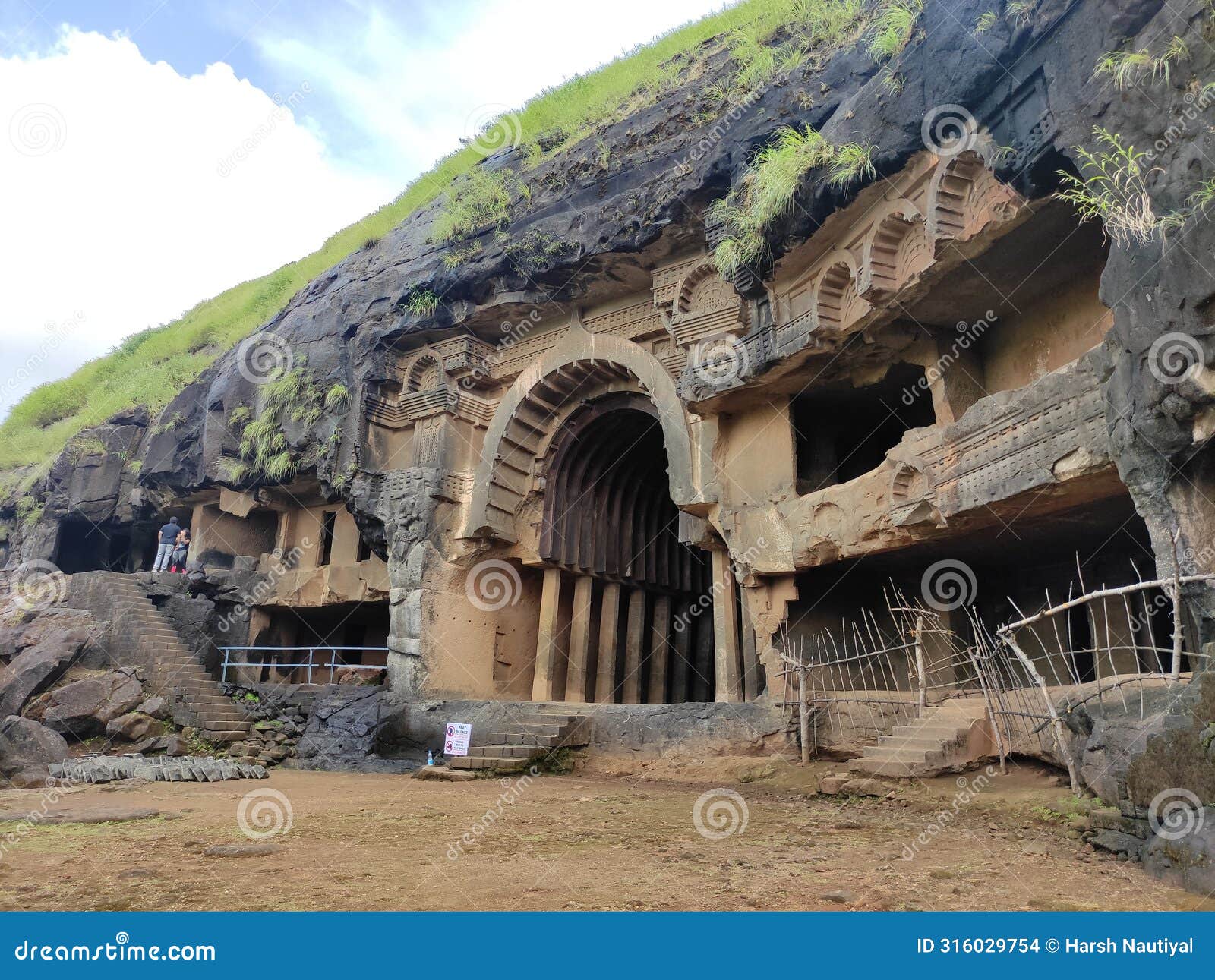Ancient Cave-like Structure with Archway, Metal-fenced Entrance ...