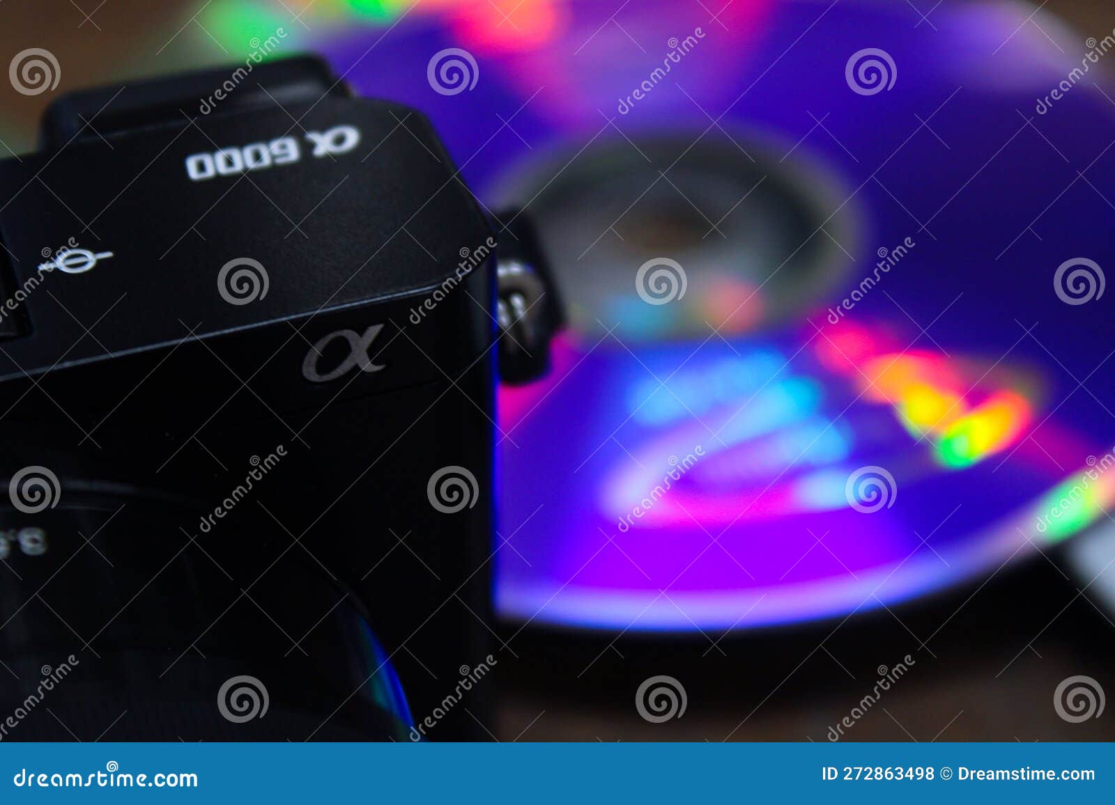 Is an Image of a Digital Camera with Several DVD Disks in the ...