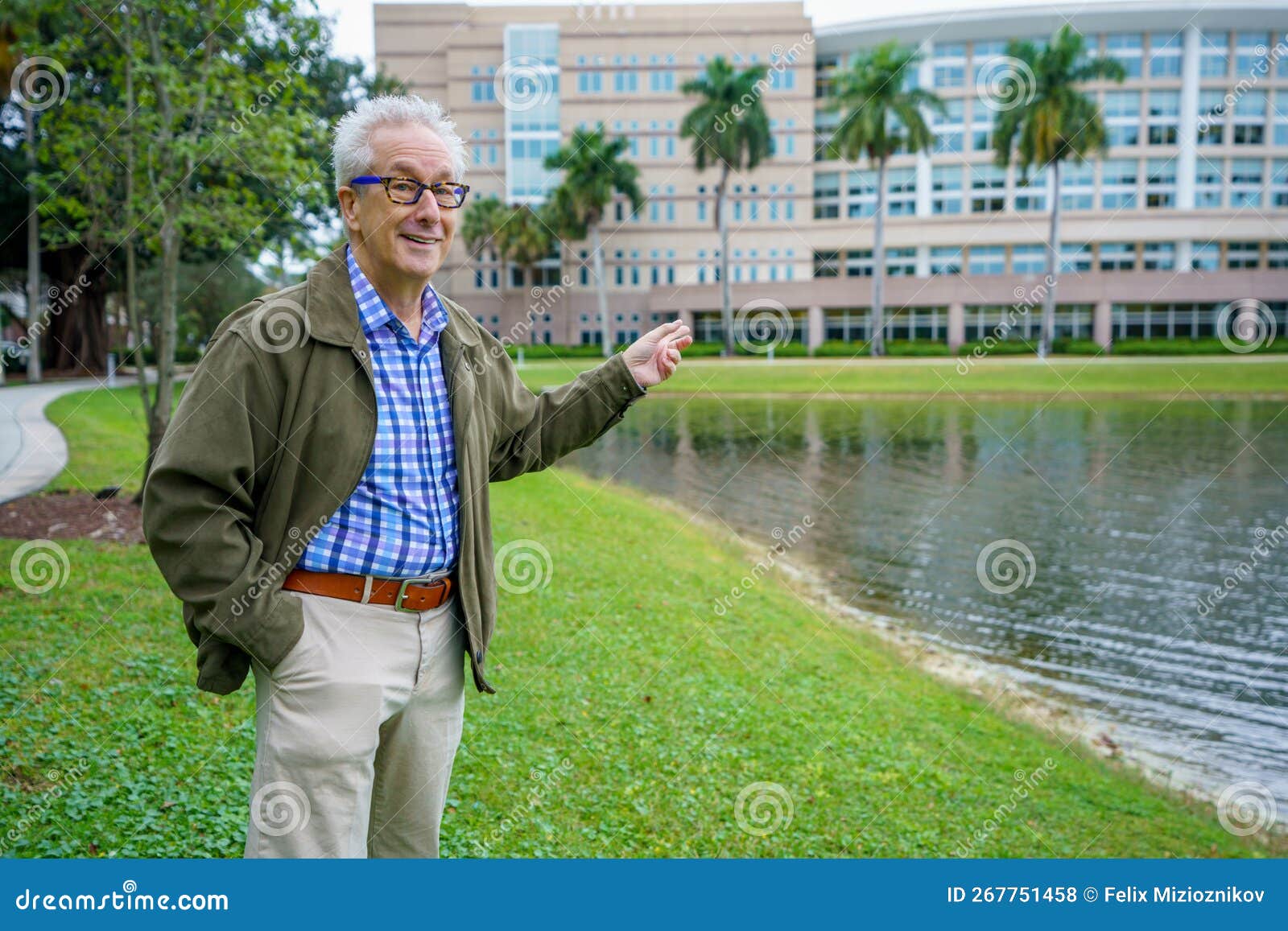 Image of a Education Professor Pointing at a Building on Campus Stock ...