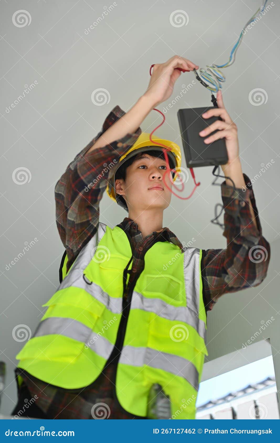 Image of Electrician with a Tool in His Hands, Working with Cable on ...