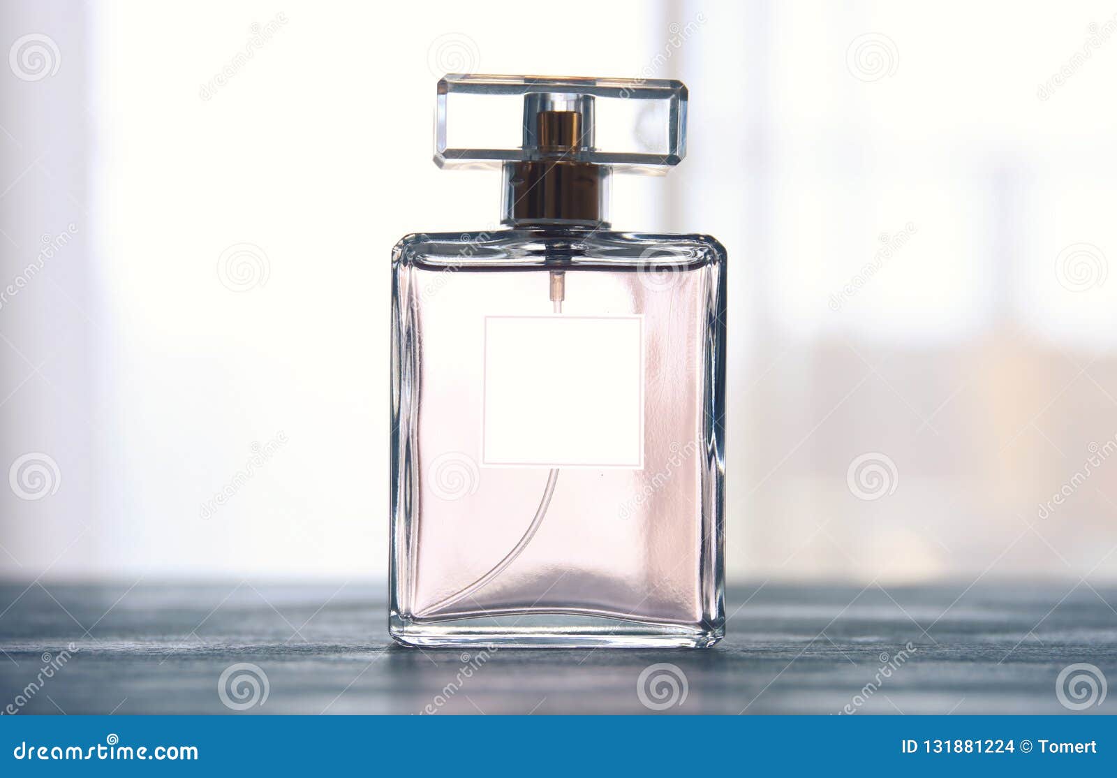 Image of Elegant Perfume Bottle. Back Light Photo. Stock Photo - Image ...