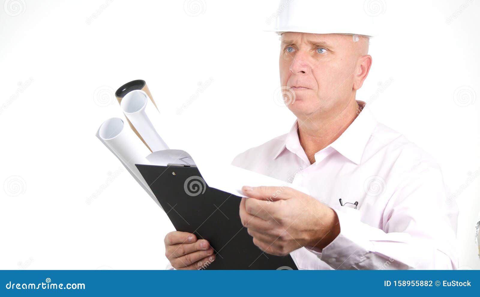 Image with Engineer Reading Technical Plans for a Building Construction ...