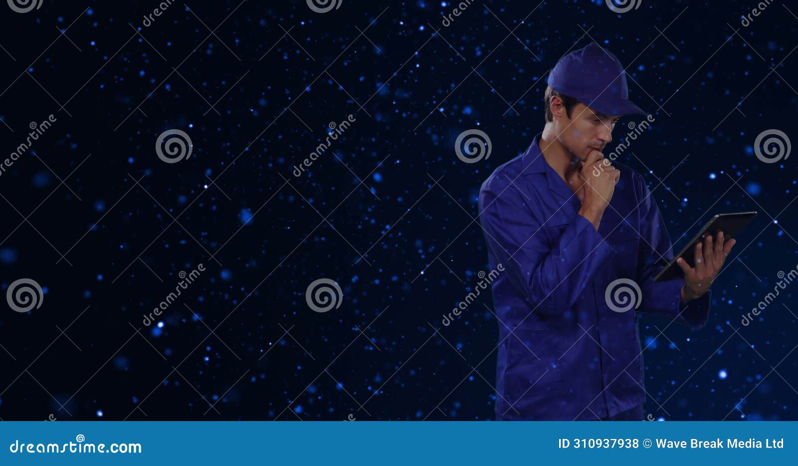 Image of Engineer Using Tablet Over Glowing Blue Spots in Background ...