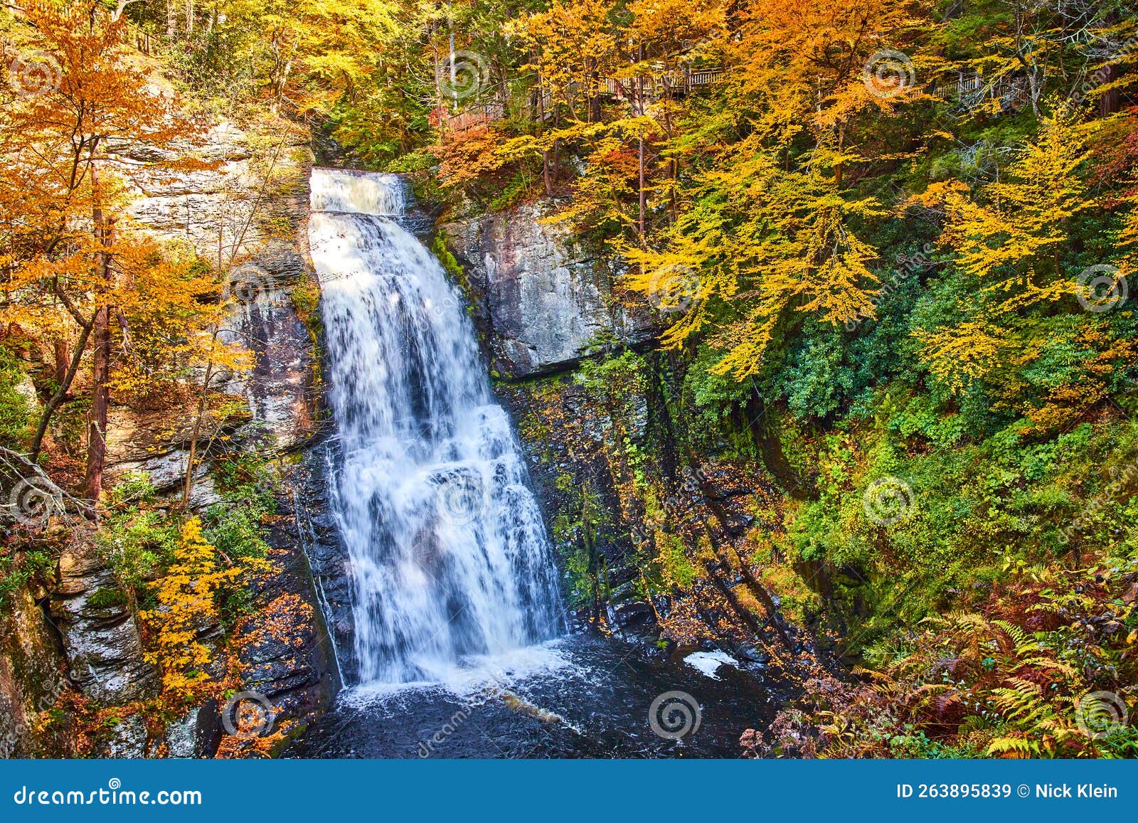 Fall Foliage Surrounds and Covers Cliffs Around Raging Waterfall into ...