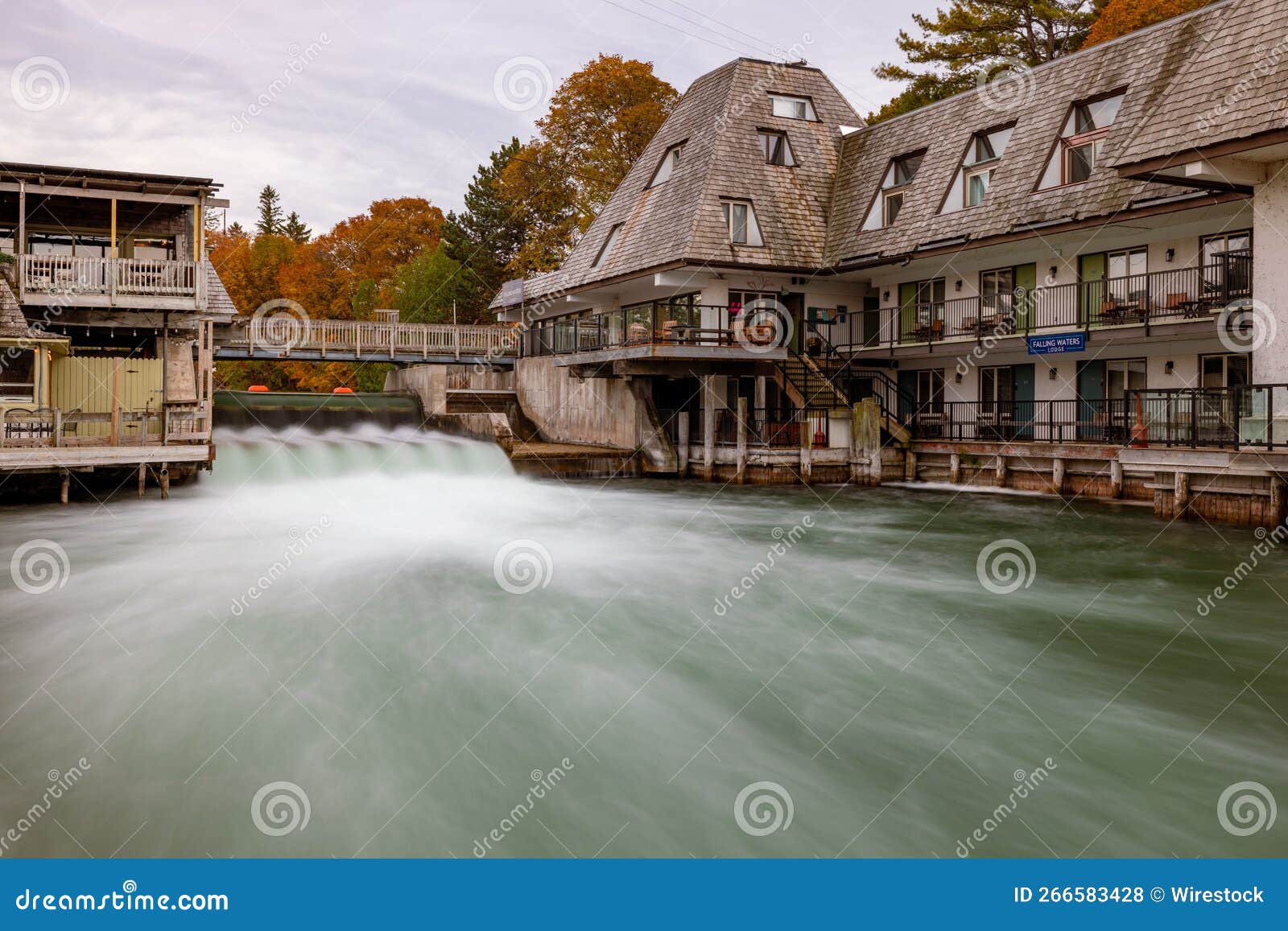 Image of Falling Water Though the Wooden Buildings. Stock Photo - Image ...