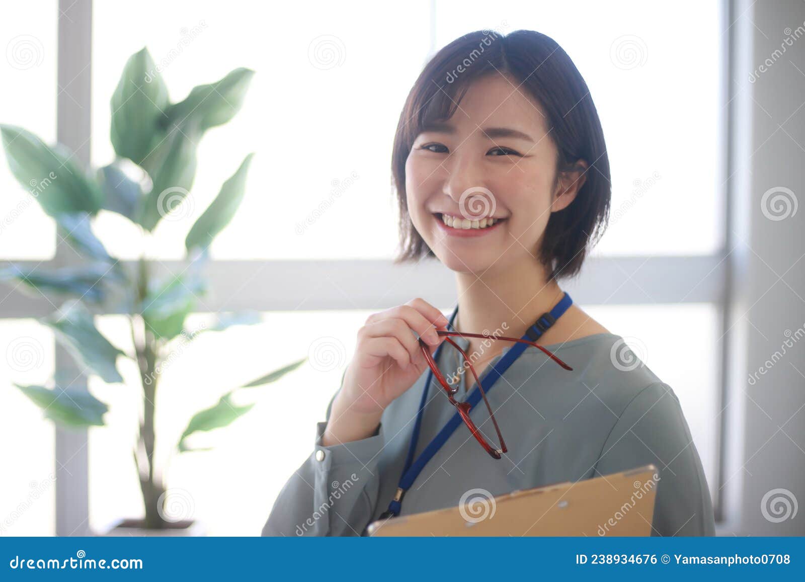 Female Employee with a Binder Stock Photo - Image of finger, dress ...