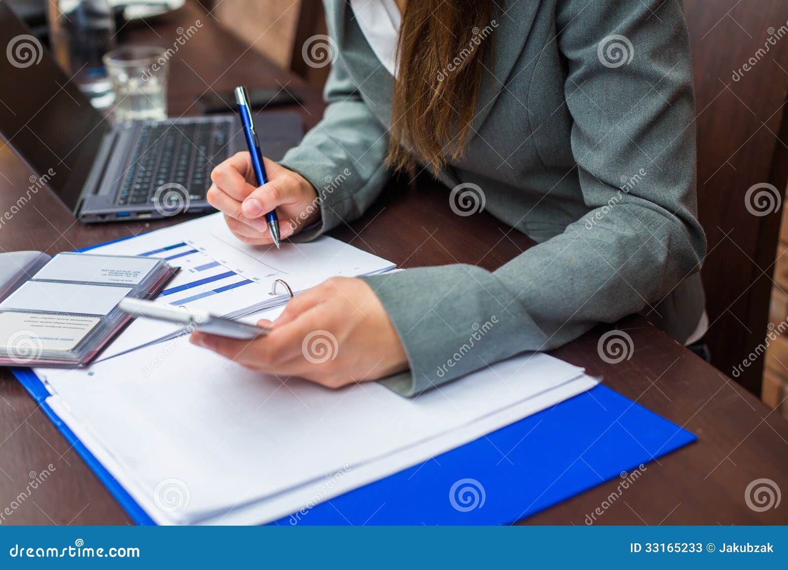 Image of Female Hands with Mobile Phone on Business Document. Stock ...